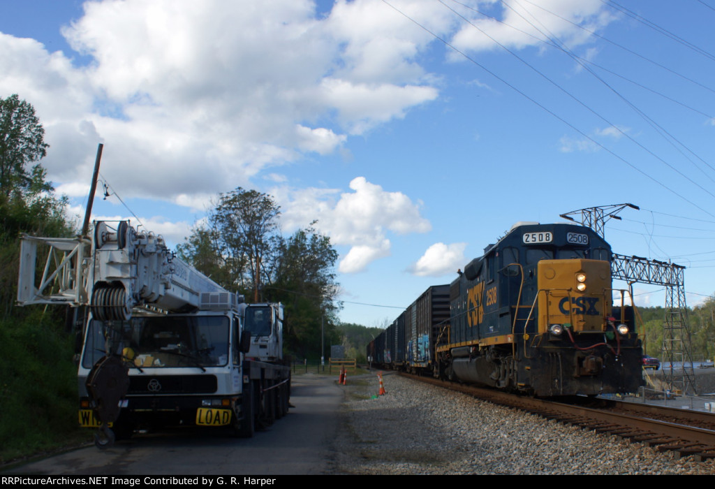H74413 local heads east back to Lynchburg. Monster crane parked on Hydro St.